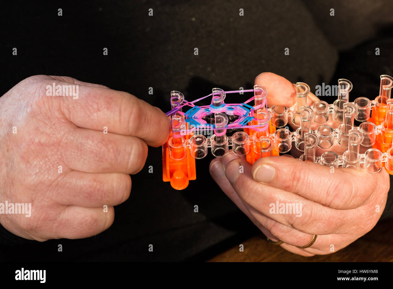 Showing how rubber bands are made by hand Stock Photo - Alamy