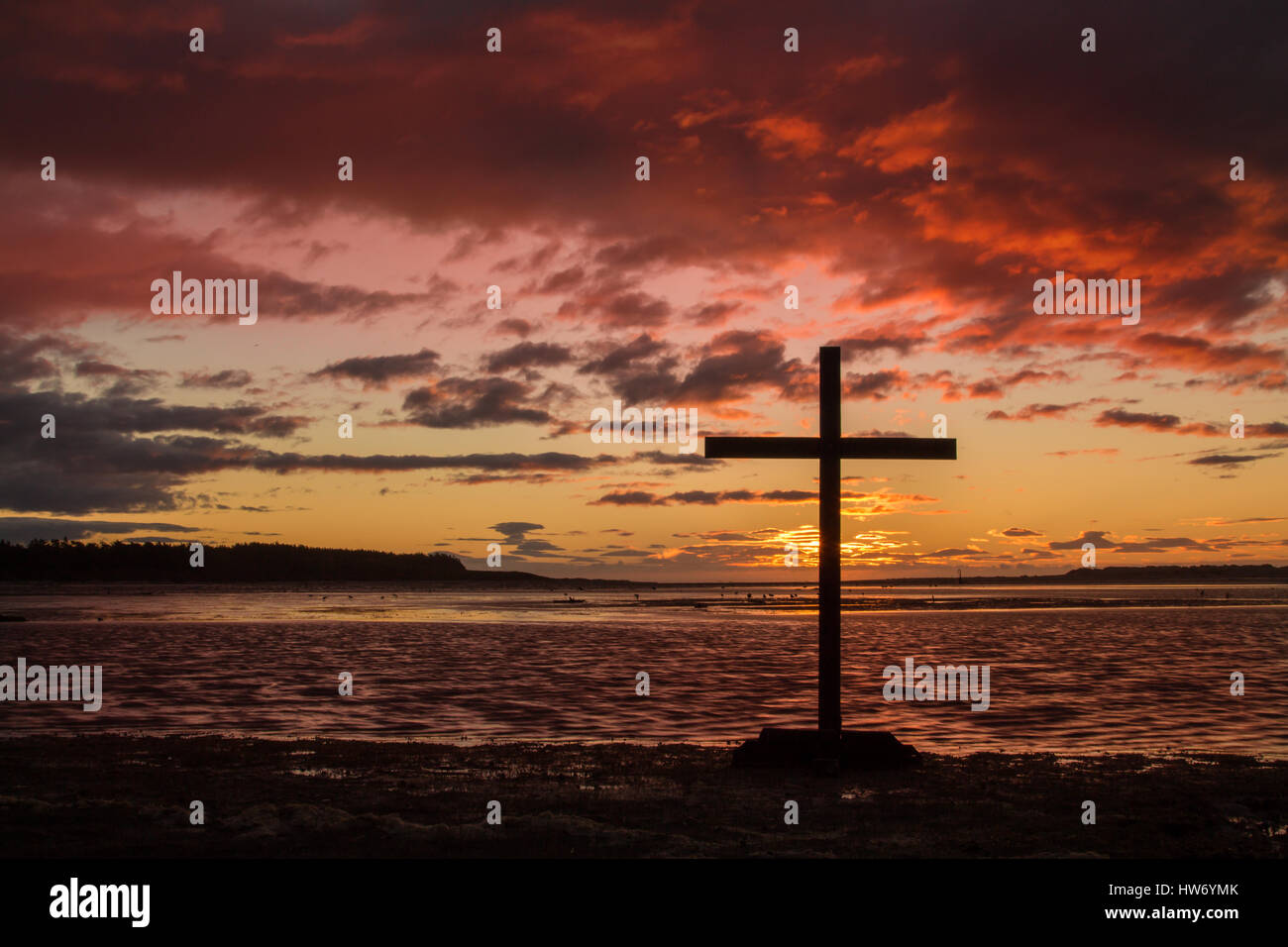 Wonderful sunset sky behind a cross Stock Photo - Alamy