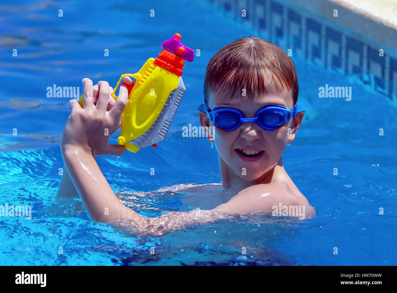Happy boy in swimming pool Stock Photo - Alamy