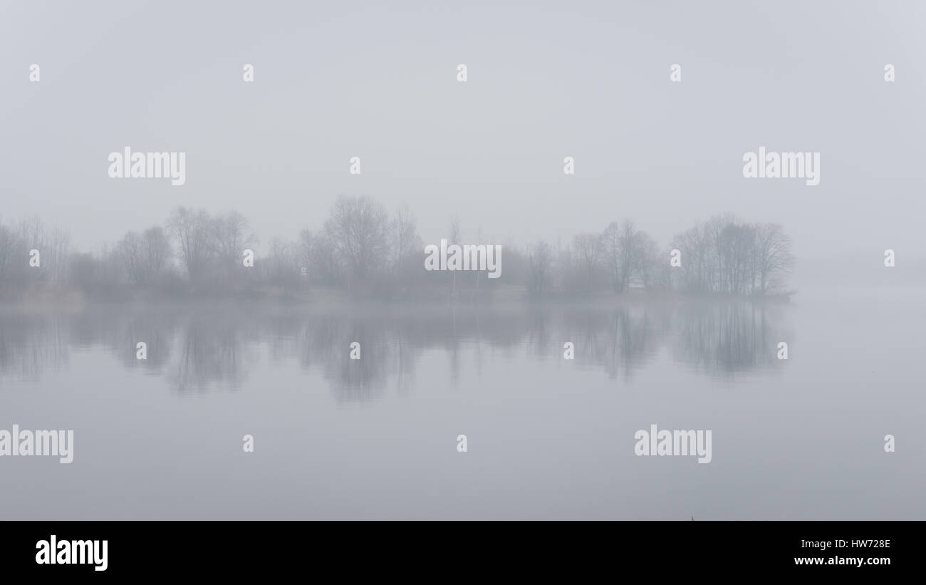 heavy mist over the river in autumn with calm water Stock Photo - Alamy