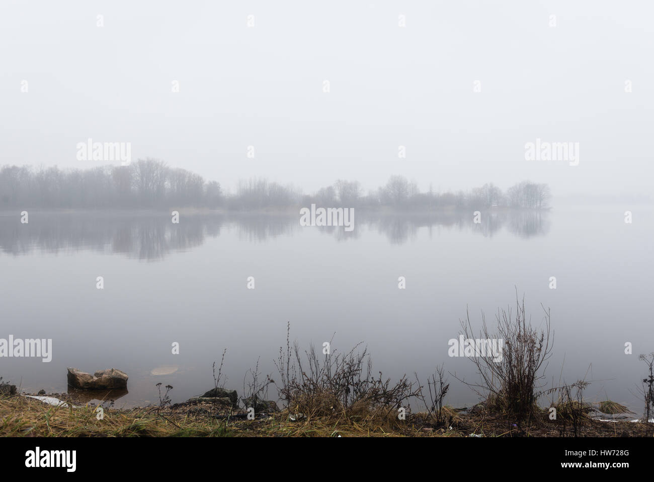 heavy mist over the river in autumn with calm water Stock Photo - Alamy