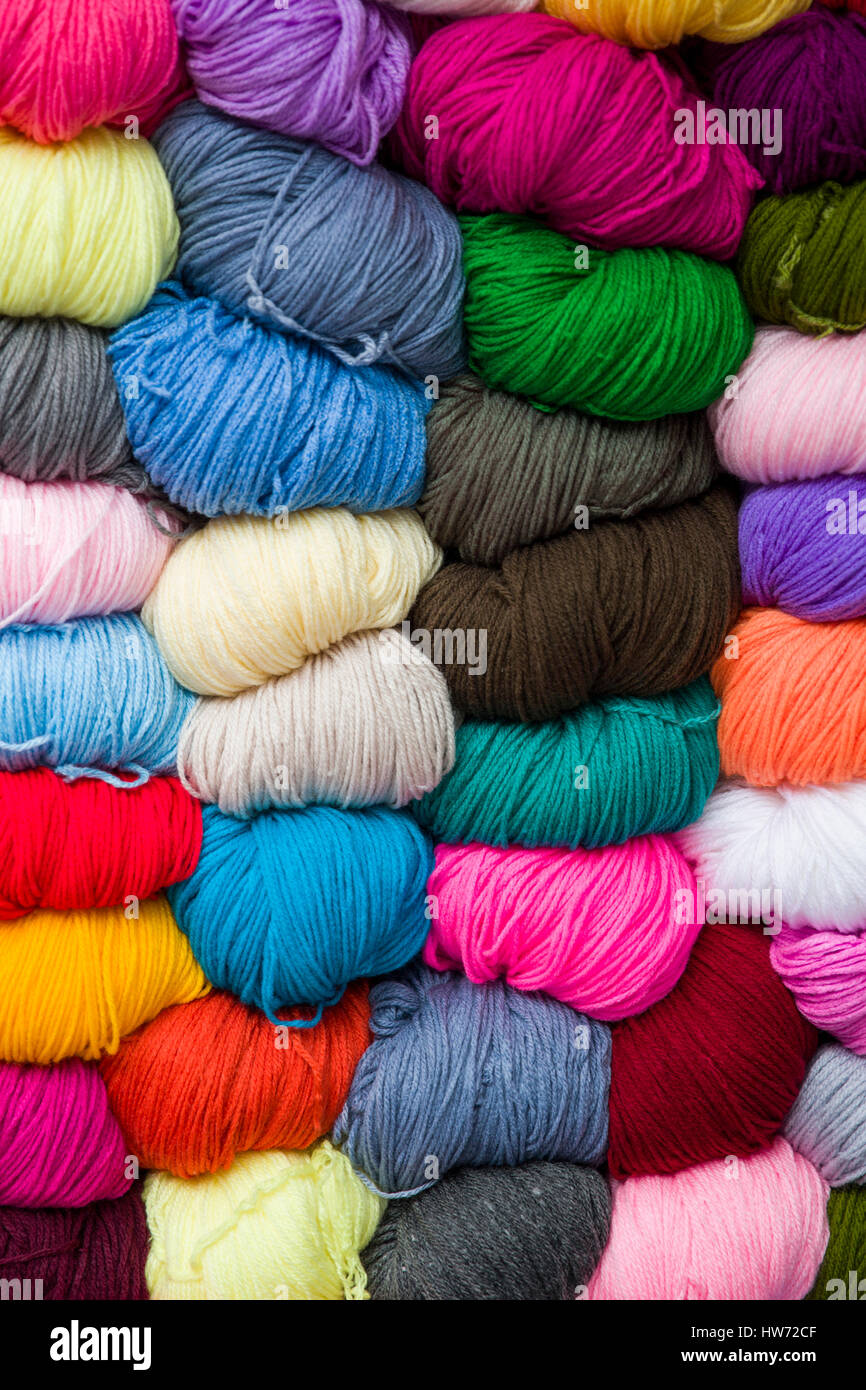 Detail of the colorful wool rolls piple Stock Photo - Alamy