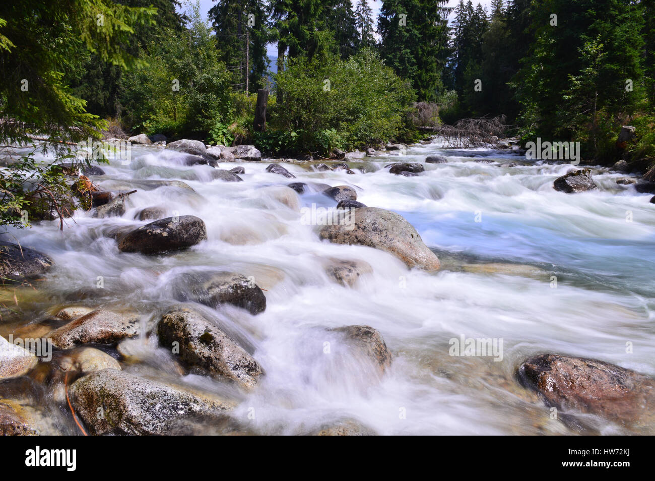 Waterfall from ravine in winter, long exposure, in mountain river with ...