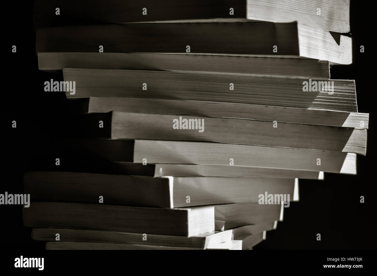swirl of stack of books in black and white sepia toned closeup Stock ...