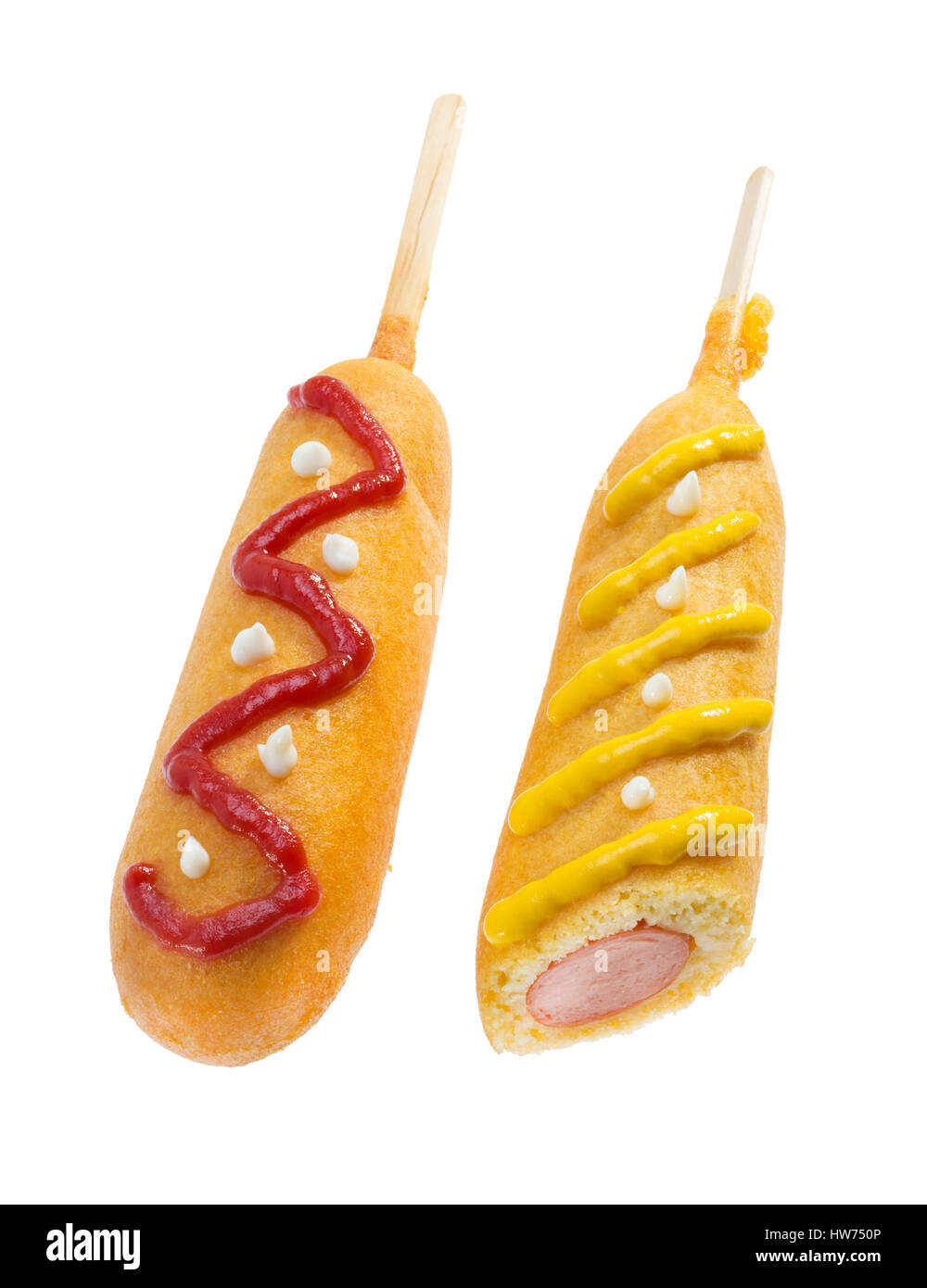 Corn dogs decorated with ketchup and mustard isolated on white ...