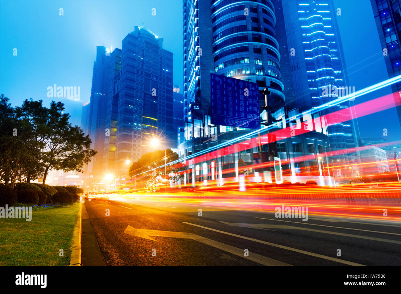 The light trails on the modern building background in shanghai china ...