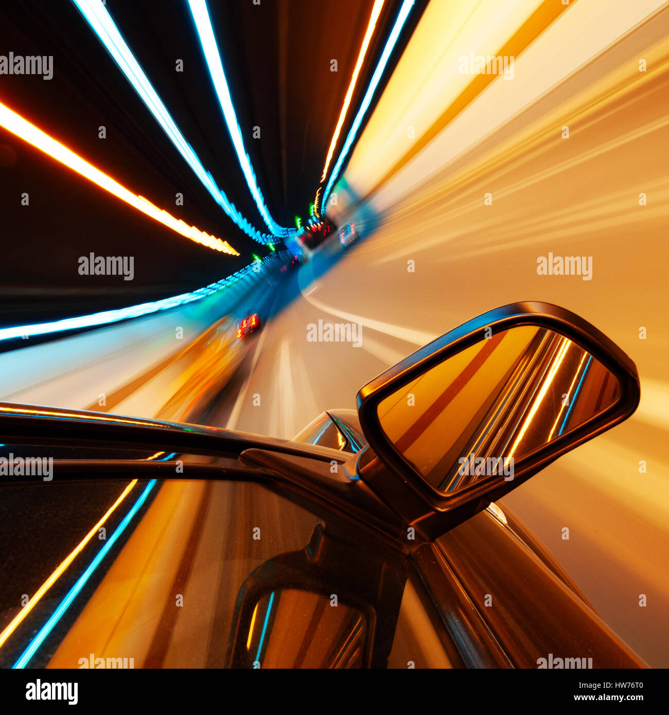 A car driving on a motorway at high speeds, overtaking other cars Stock ...