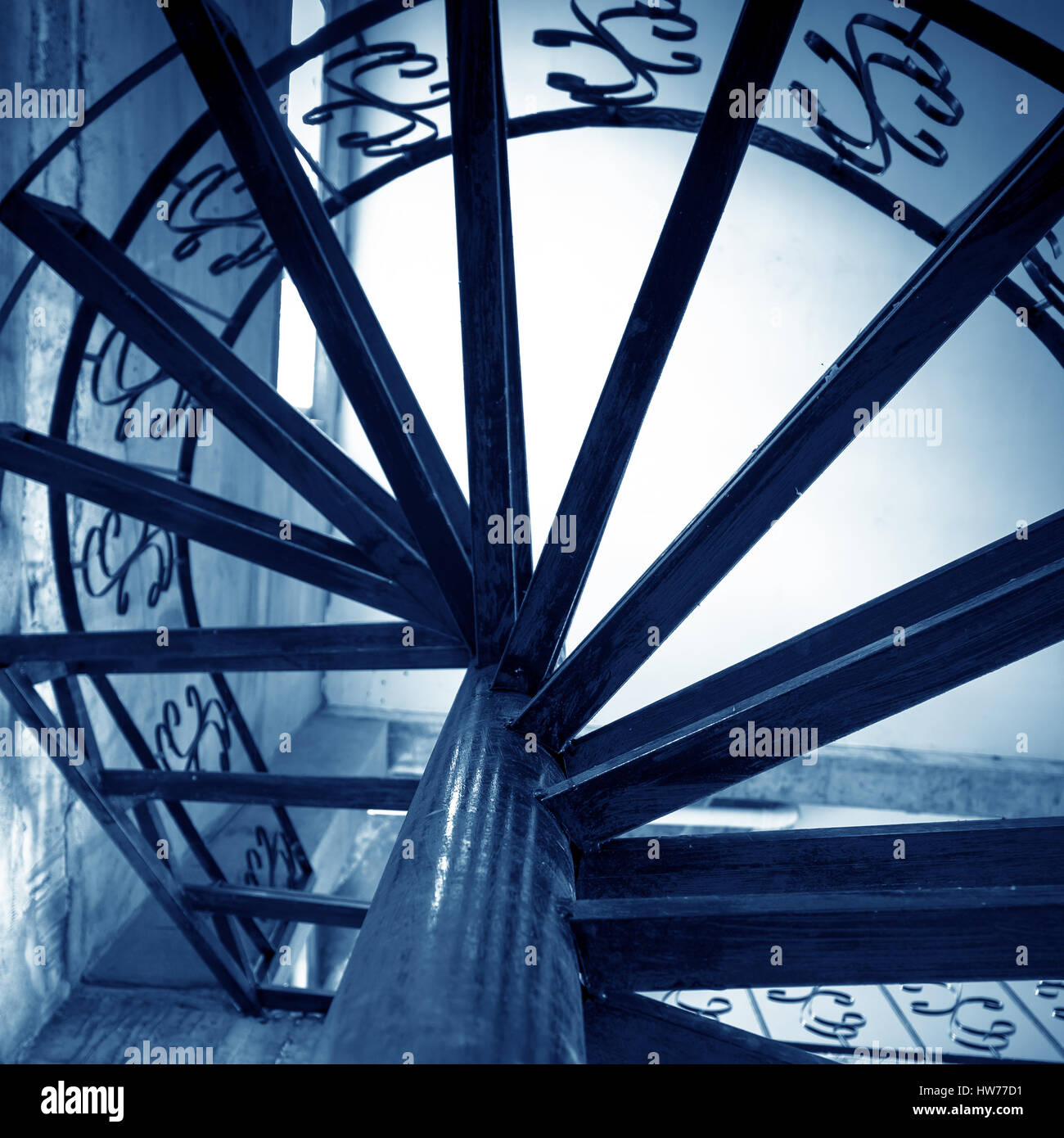 Sleek metal spiral staircase, modern architectural interior decoration ...