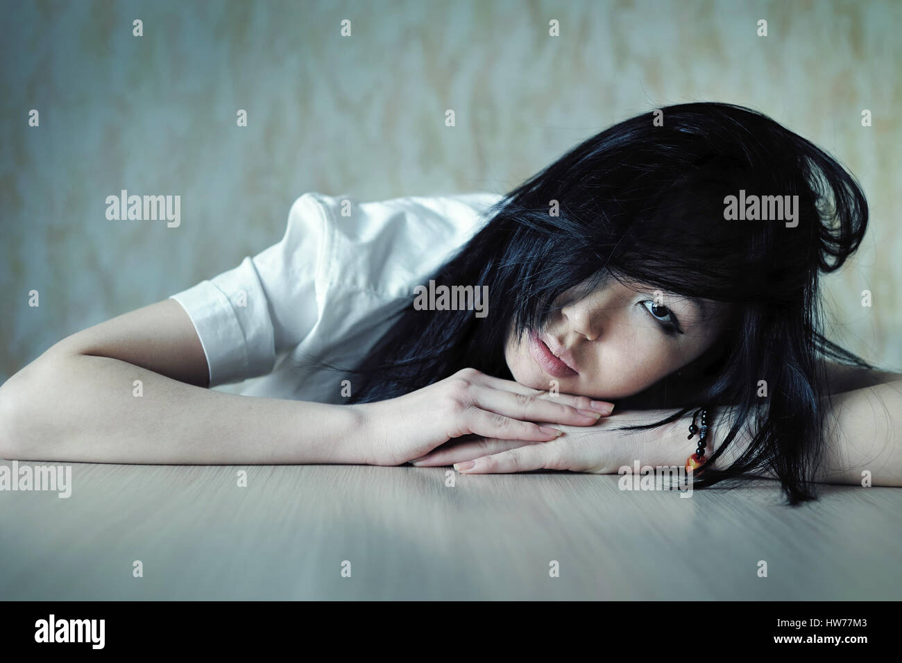 Asian girl rest on the table Stock Photo - Alamy