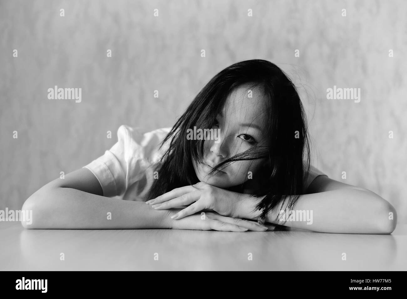 Girl rest on the table Stock Photo - Alamy