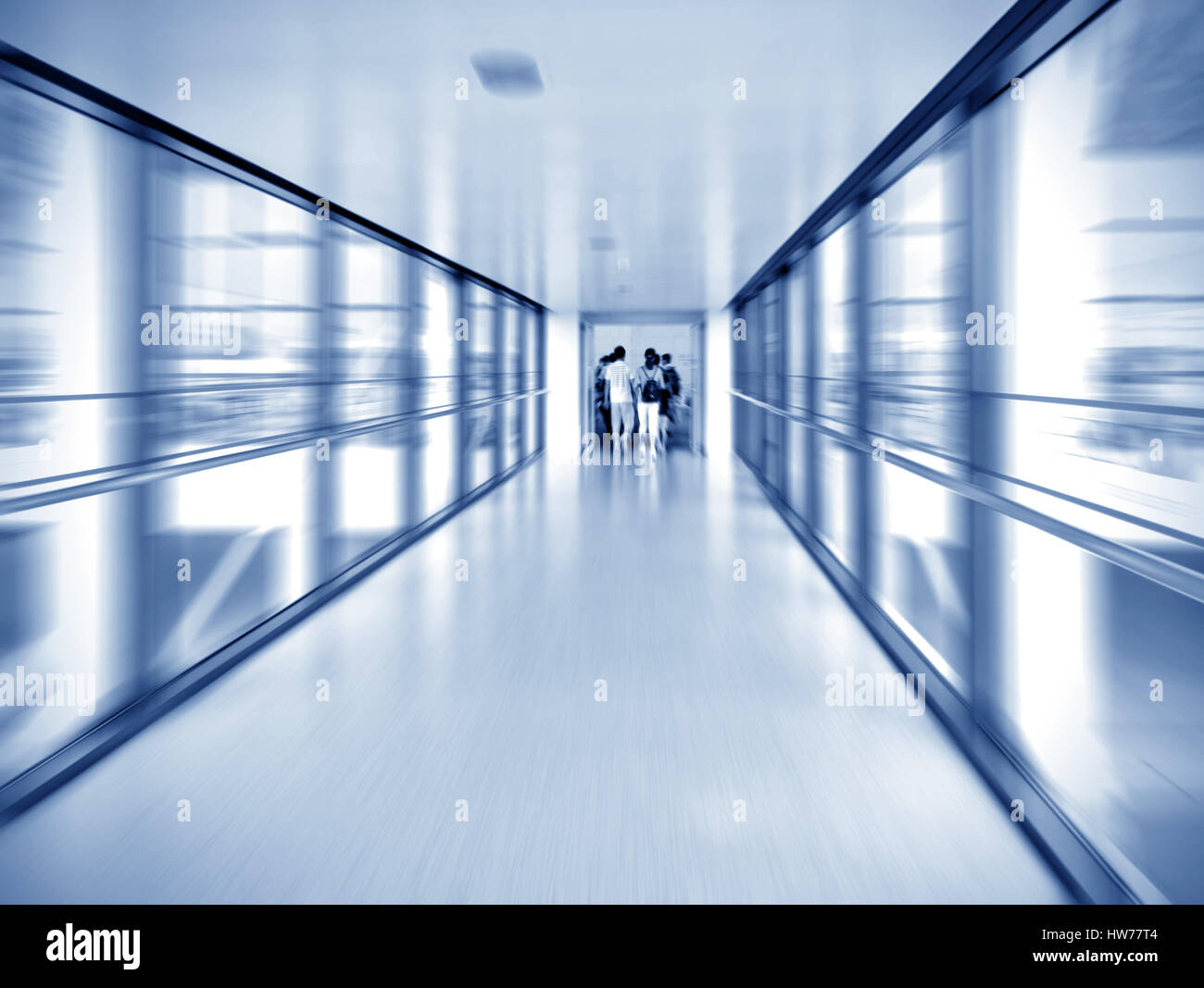 Crowd walking in a corridor Stock Photo - Alamy