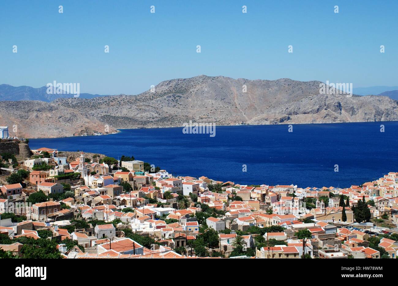 Looking down onto the pastel coloured neo classical buildings of Chorio ...