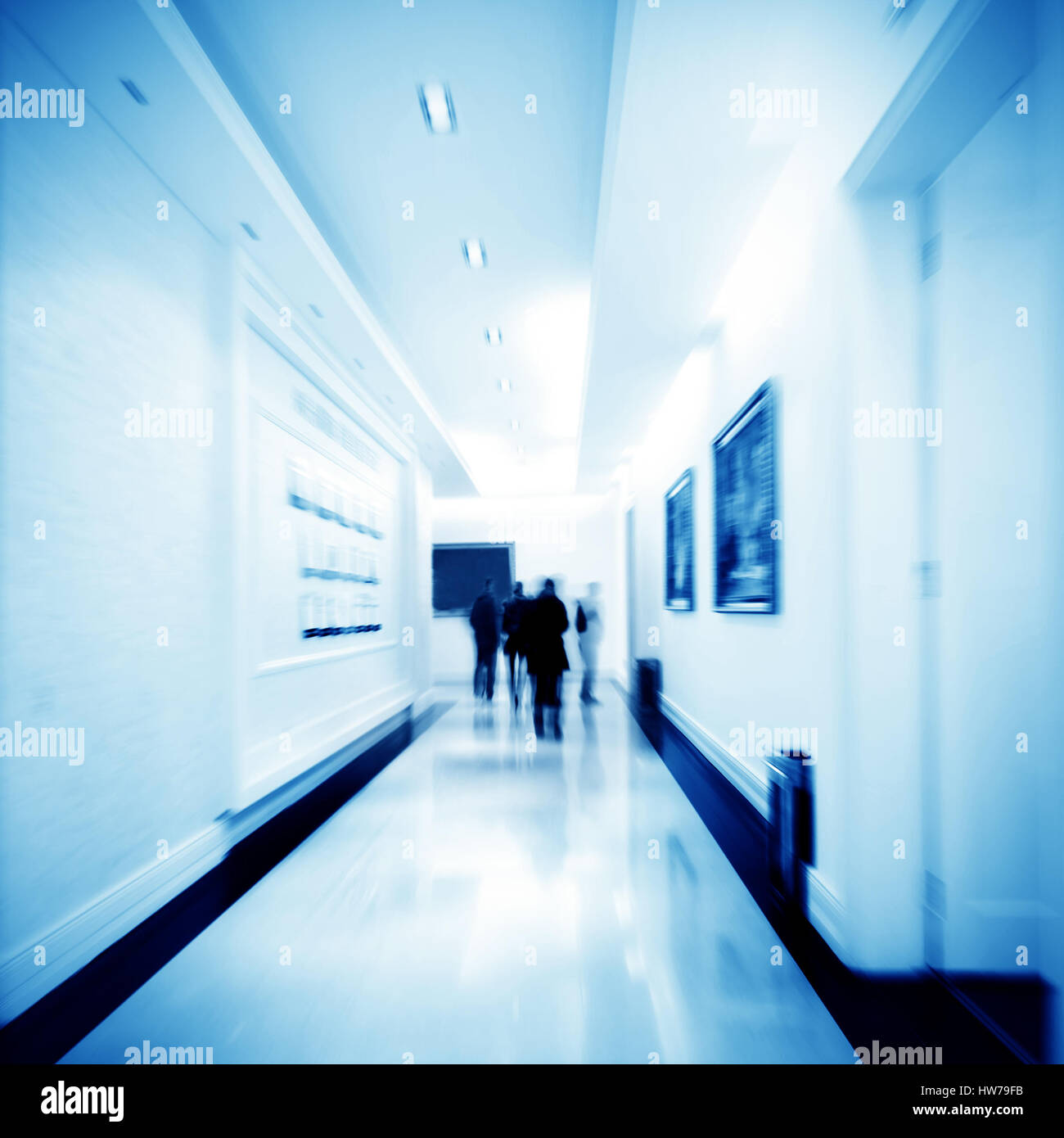 Crowd walking in a corridor Stock Photo - Alamy
