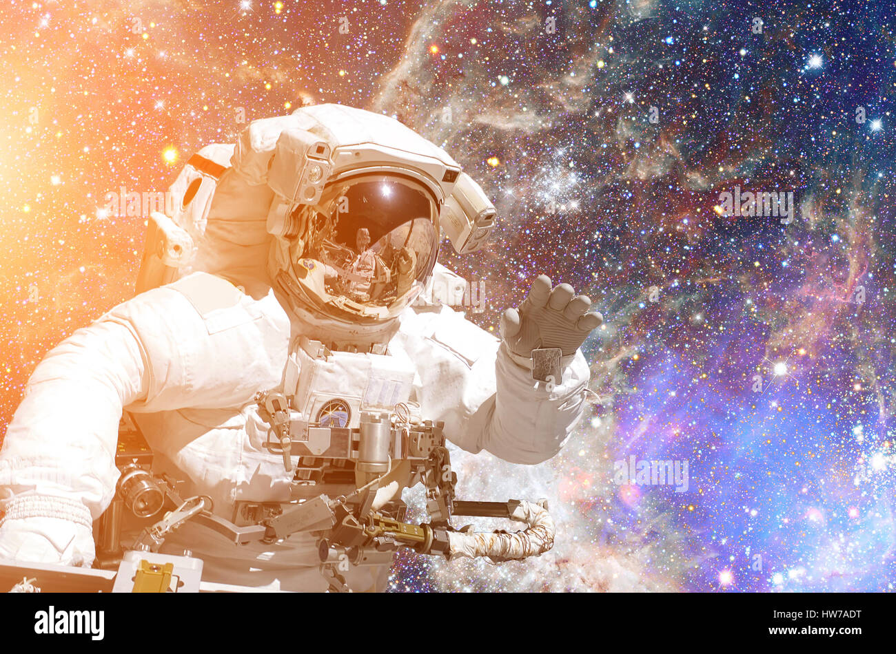 Astronaut in outer space. Galaxy and stars on the background. Elements ...