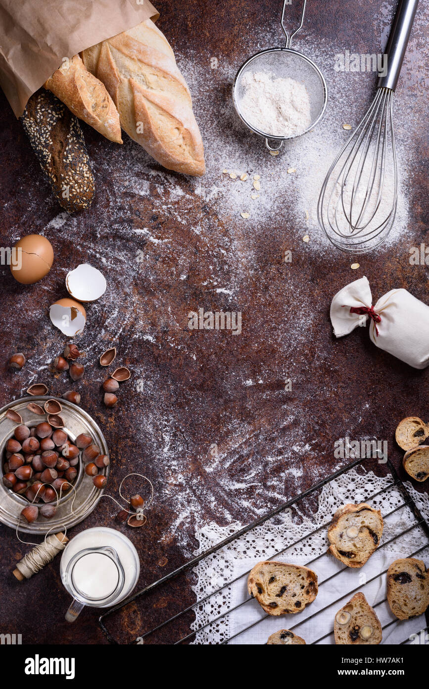 Bakery produce - bread, baguette, cookies over rustic background ...
