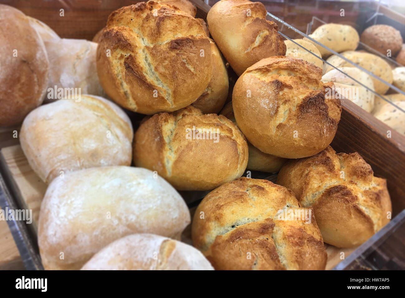 Different types of fresh and crispy baked rolls from the bakery for ...