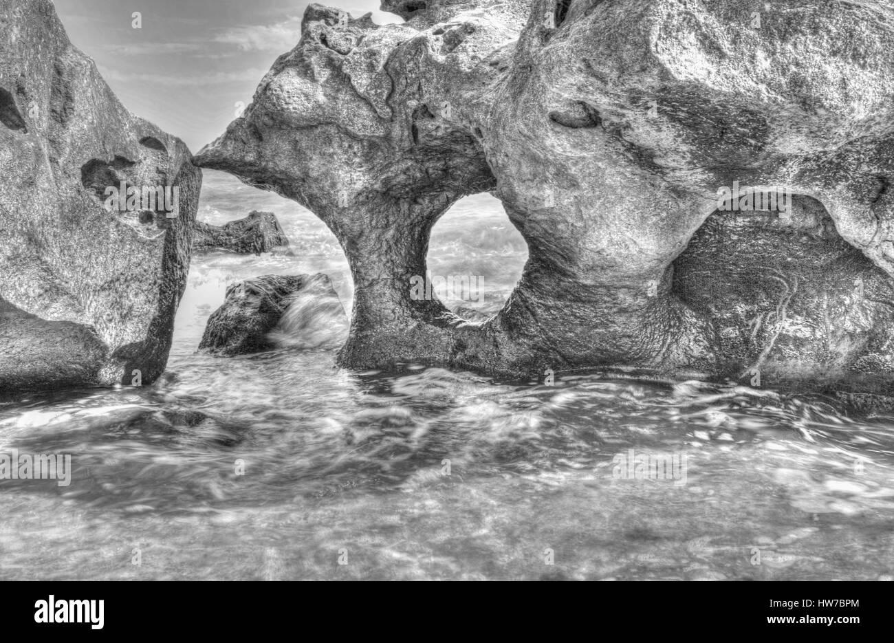 Landscape on rocky shore with beautiful rock formation and sea waves in ...