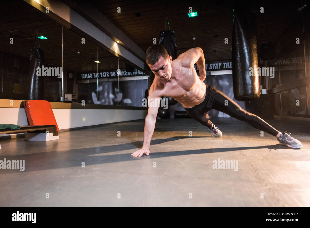 Young shirtless athletic man doing one hand push ups Stock Photo - Alamy