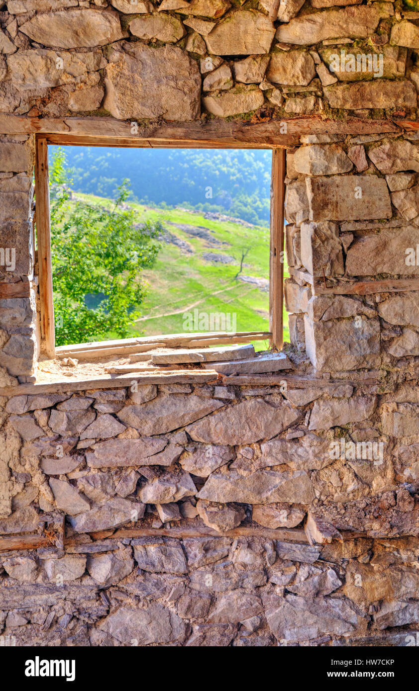 Look through window from abandoned stone house in the mountain Stock ...