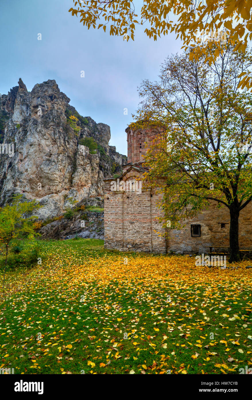 Beautiful landscape with church in the mountain and colorful autumn ...