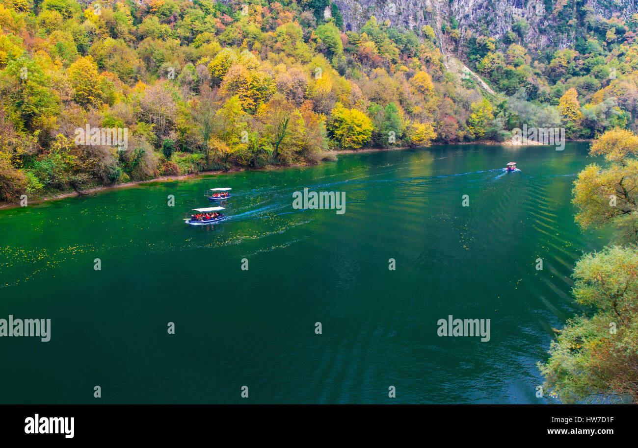 Beautiful landscape view with boat on the river and colorful autumn ...