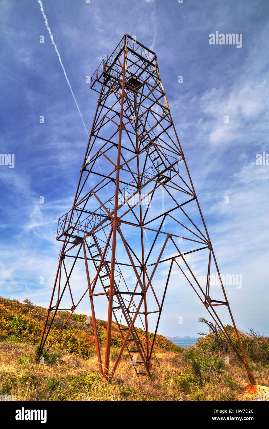 Metallic tower up to the clouds in blue sky Stock Photo - Alamy