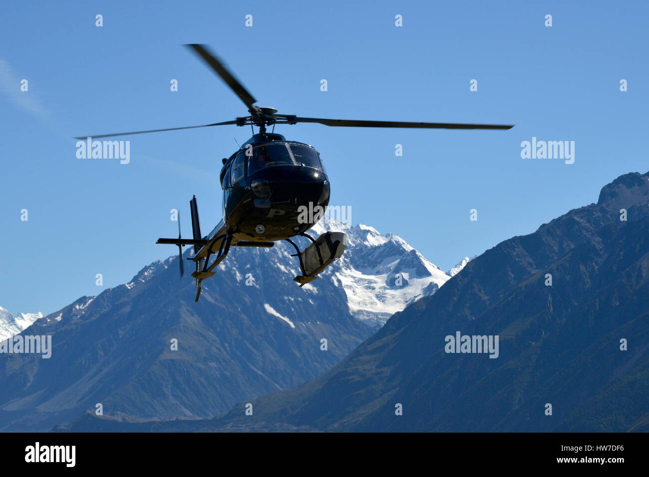 Helicopter with Mount Cook and alps in background. Mt Cook National ...