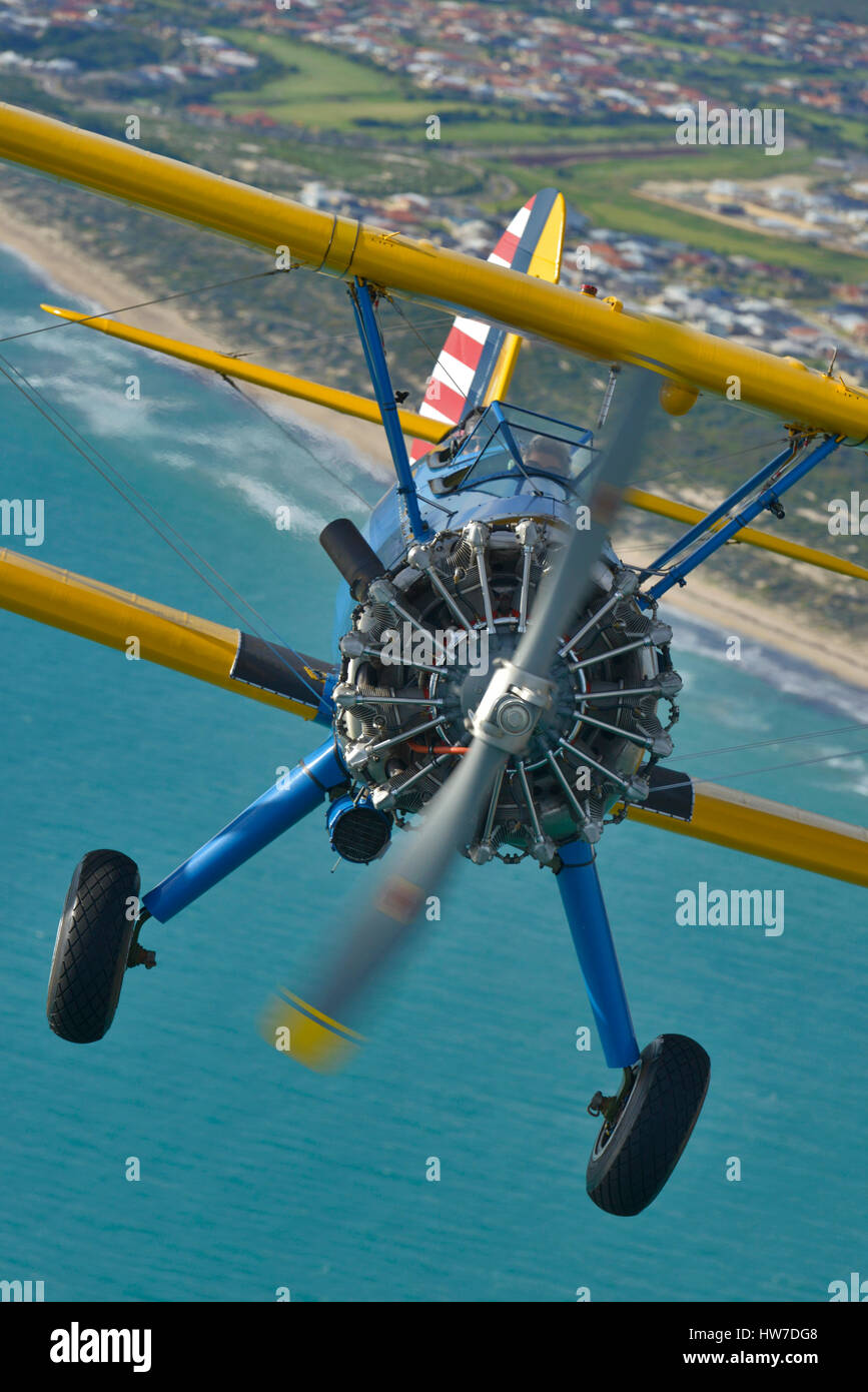 Aerial photo shoot of Boeing stearman biplane with smoke. Western ...