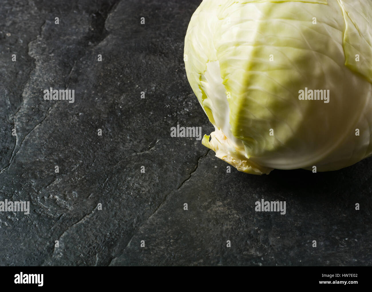 Cabbage on a black stone background. Place for the text Stock Photo - Alamy