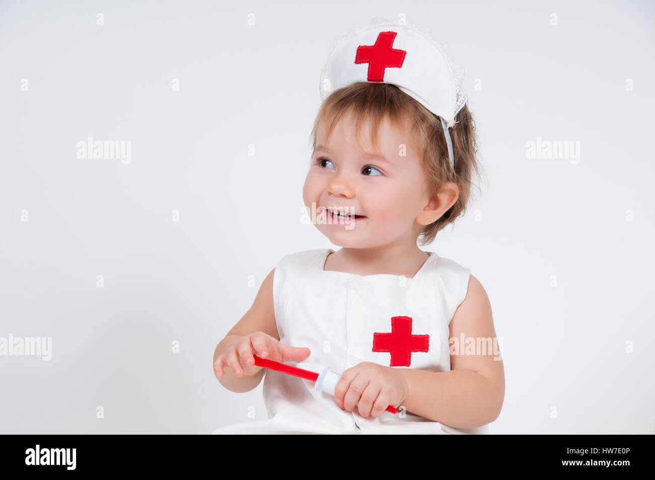child playing as a doctor with syringe Stock Photo - Alamy