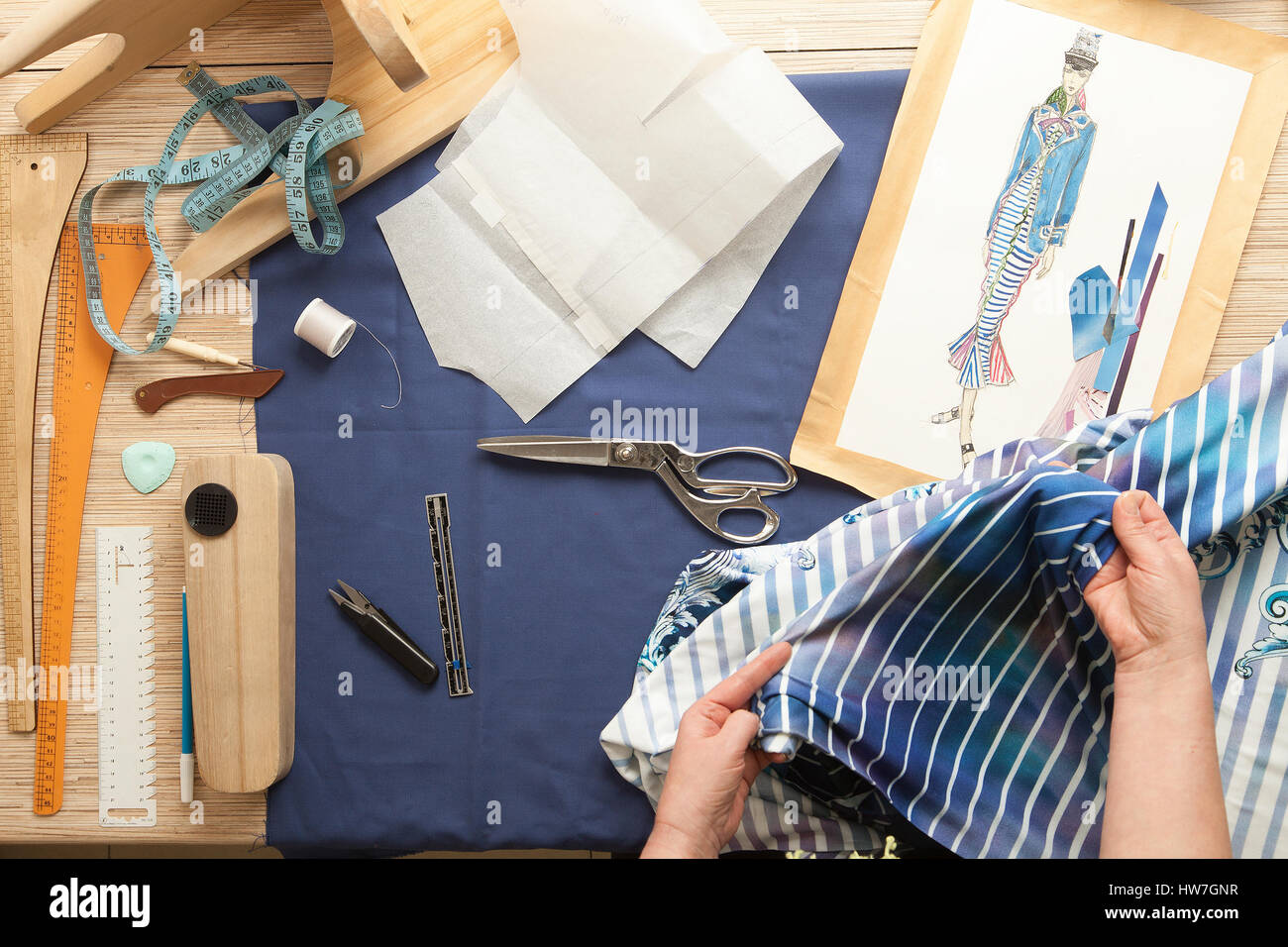 Table of skilled tailors working Stock Photo - Alamy