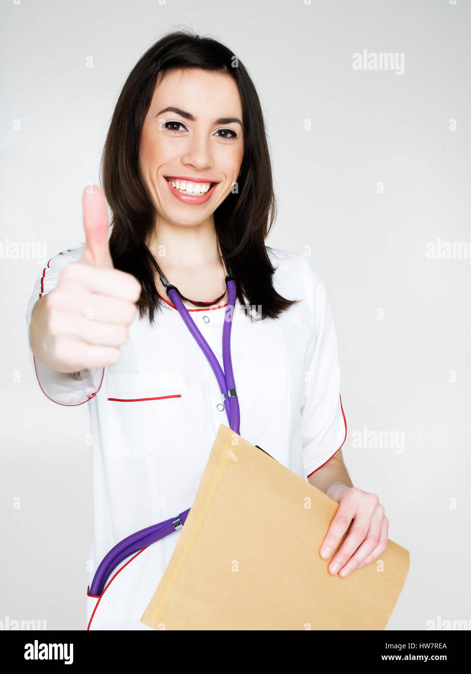 young pretty woman doctor with stethoscope emotional posing, pointing ...