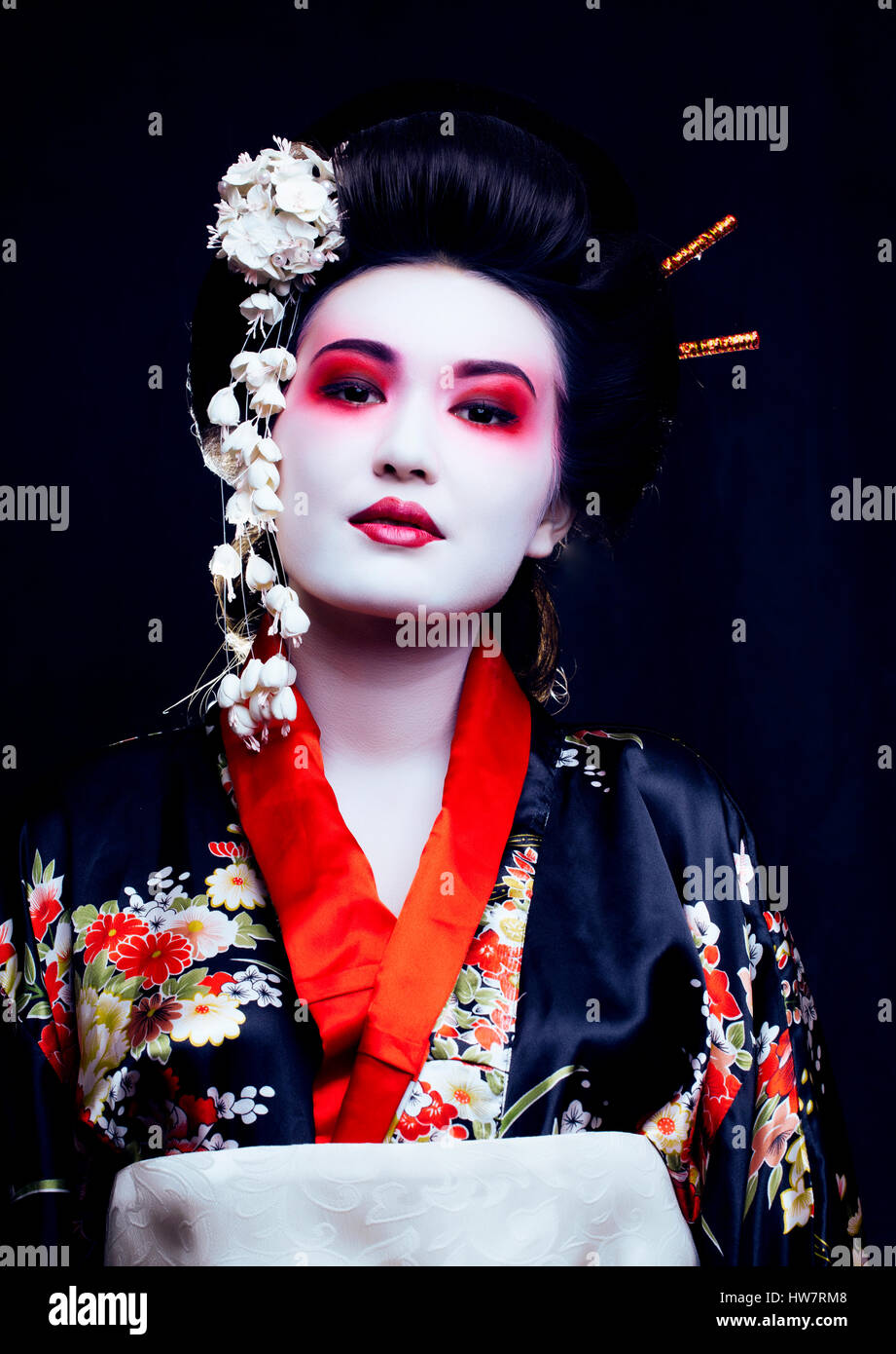 young pretty real geisha in kimono with sakura and decoration Stock ...