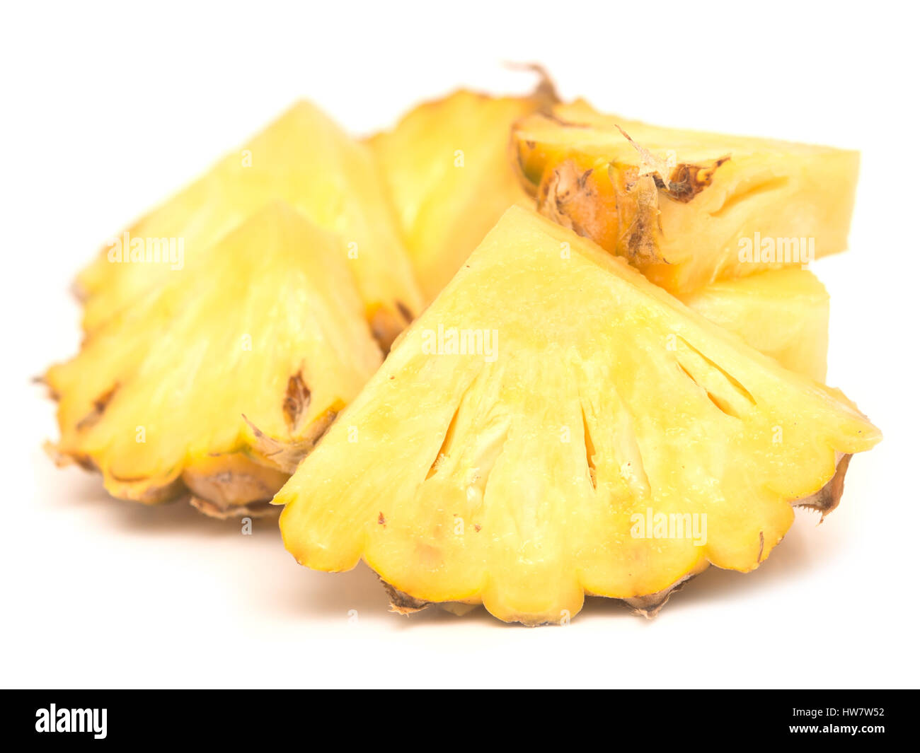 pieces of ripe pineapple isolated on white background Stock Photo - Alamy