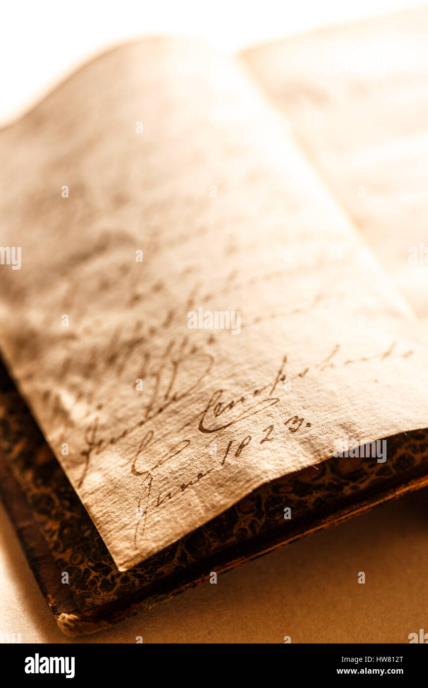 Old book with handwriting text in closeup Stock Photo - Alamy