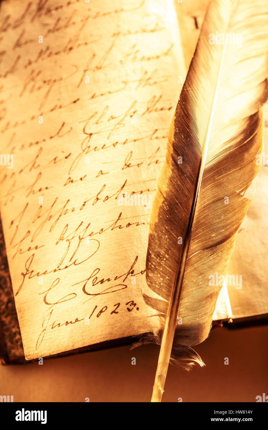Old book with feather pen in toning Stock Photo - Alamy