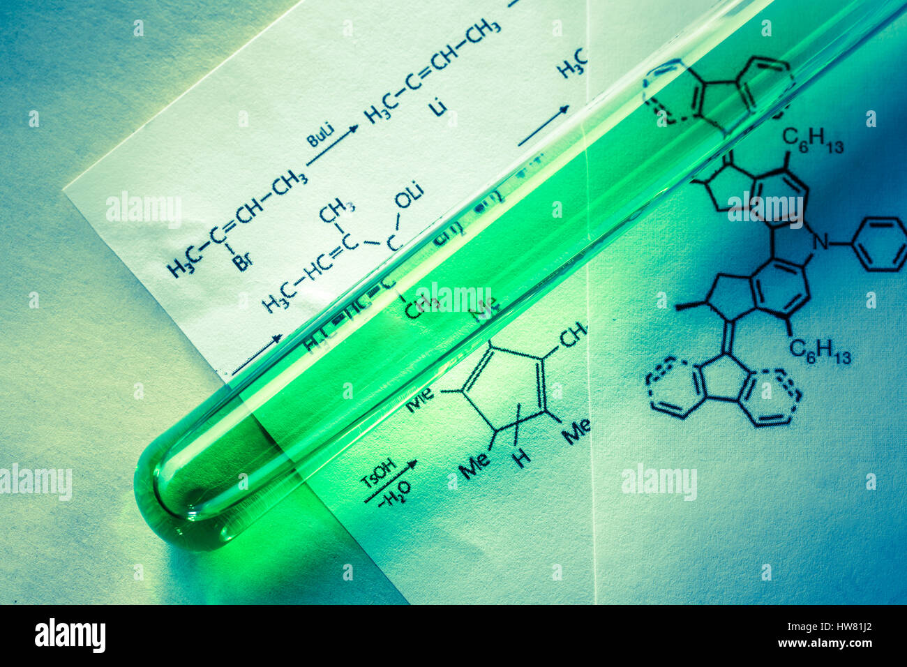 Chemical tube with reaction formula in light Stock Photo - Alamy