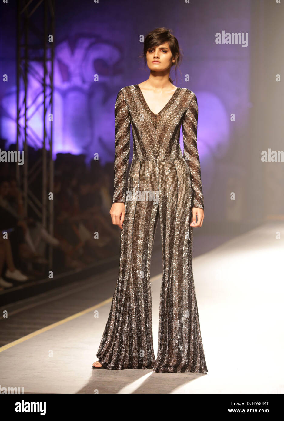 New Delhi, India. 17th Mar, 2017. A model presents a creation of ...