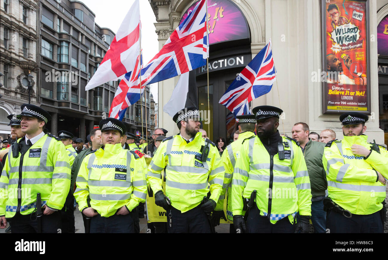 London, UK. 18 March 2017. Police protect a handful of right-wing ...