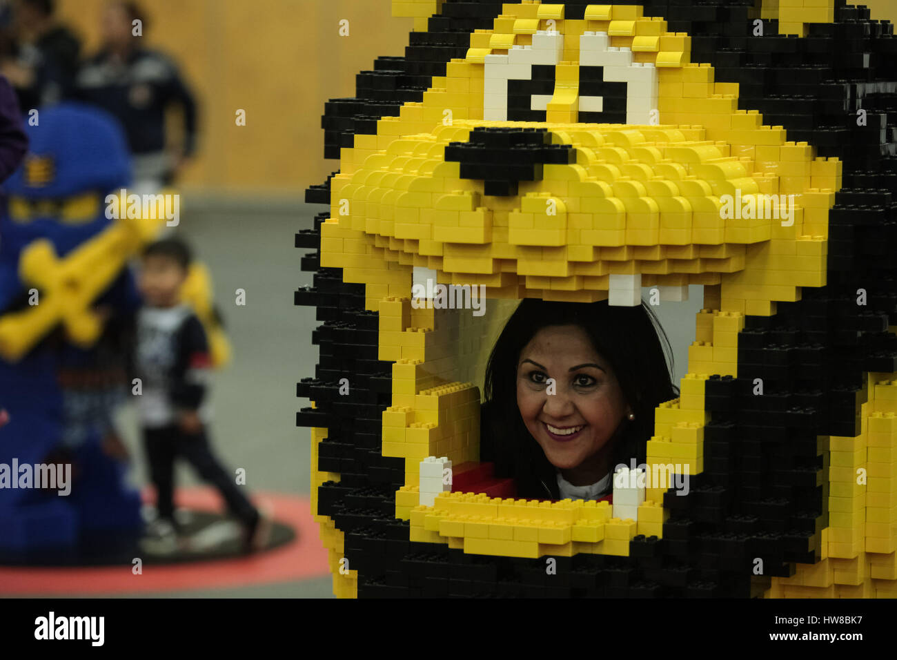 Bogota, Lego. 12th Apr, 2017. A woman poses with a figure made of Lego ...