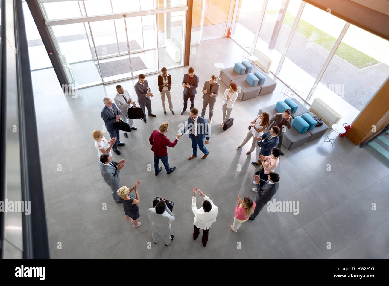 Business manager congratulates to excellent worker in center of circle ...