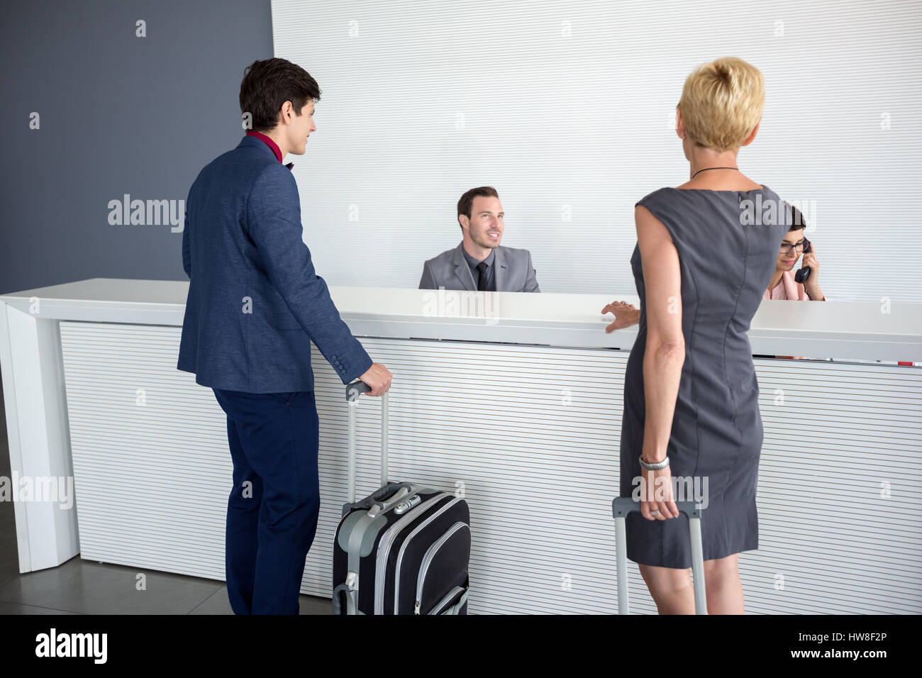 Passengers at reception Stock Photo - Alamy