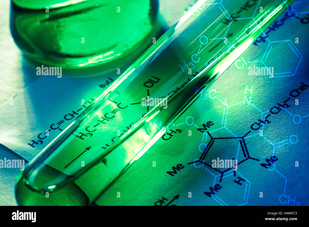 Chemical tube with reaction formula in light Stock Photo - Alamy