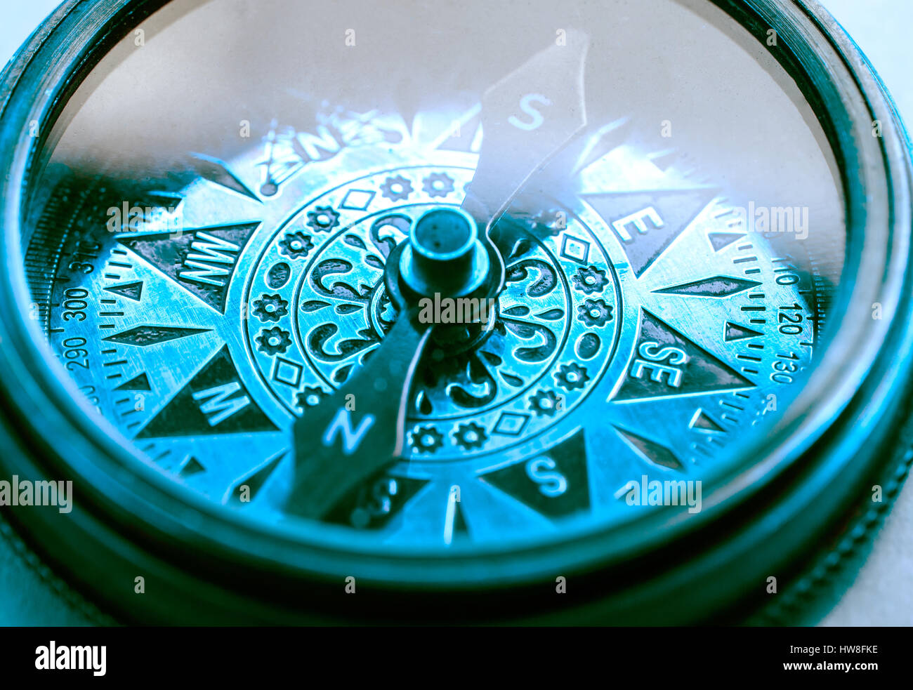 Vintage metal compass in toning light closeup Stock Photo - Alamy