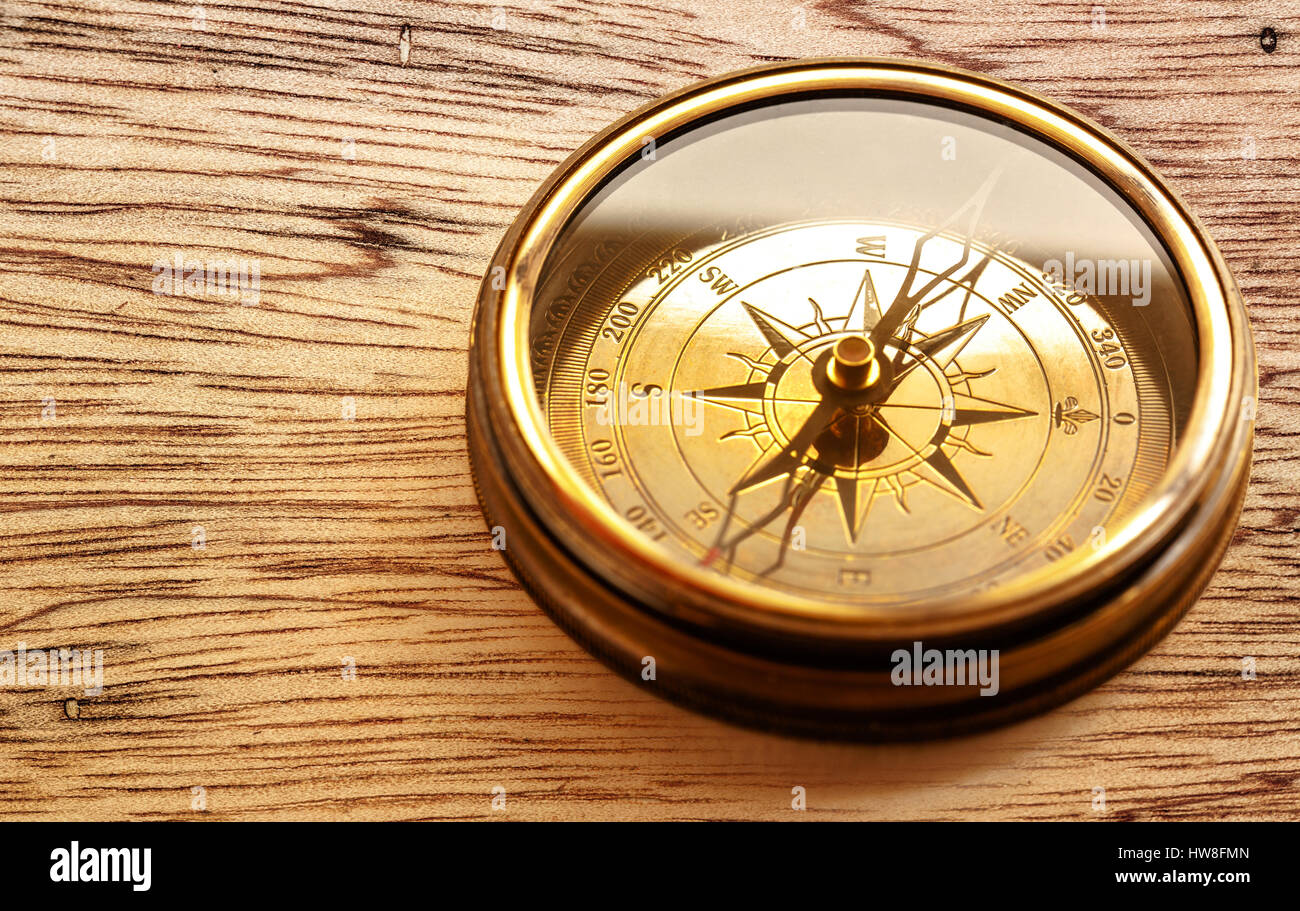 Vintage metal compass in toning light closeup Stock Photo - Alamy