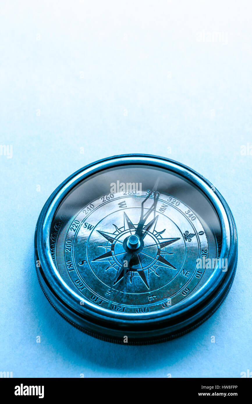 Vintage metal compass in toning light closeup Stock Photo - Alamy