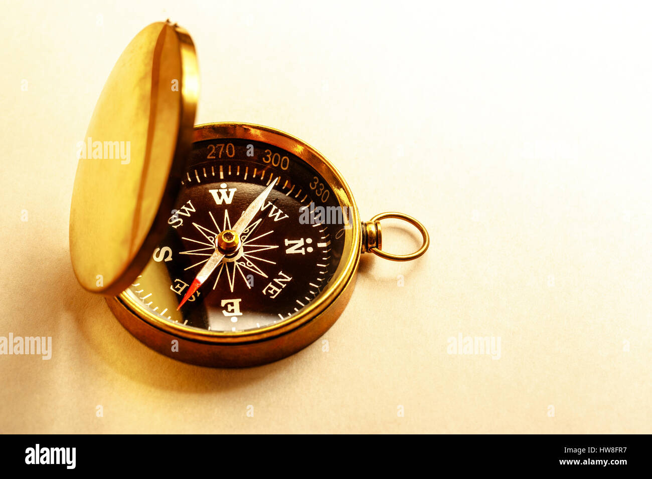 Vintage metal compass in toning light closeup Stock Photo - Alamy
