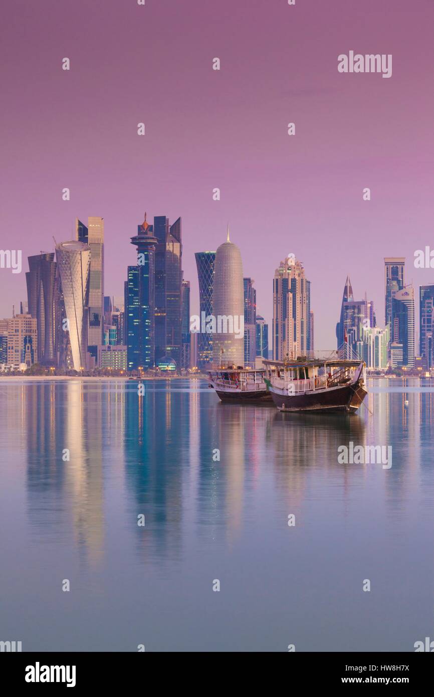 Qatar, Doha, Dhows on Doha Bay with West Bay skyscrapers, dawn Stock ...