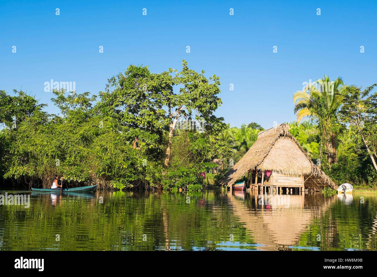 Guatemala, Izabal department, Rio Dulce river, local house on stilts ...