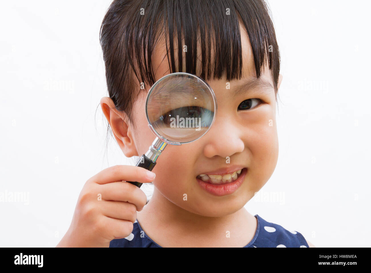 Asian Little Chinese Girl Holding Magnifying Glass isolated on White ...